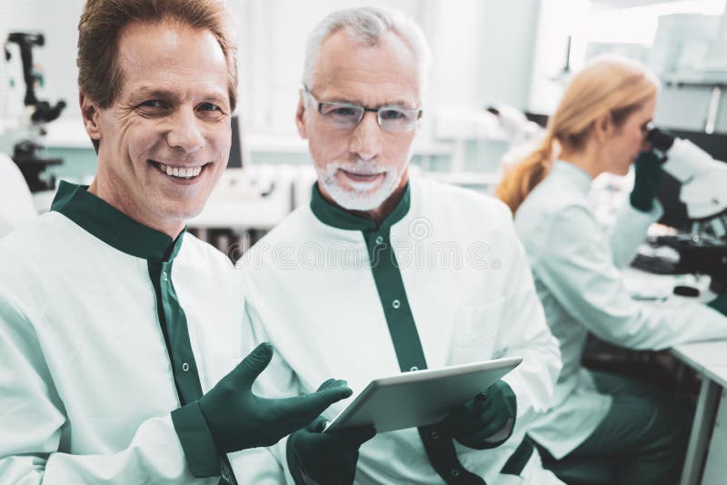 Dark-haired Biologist Smiling after Studying Molecular Chain Stock ...
