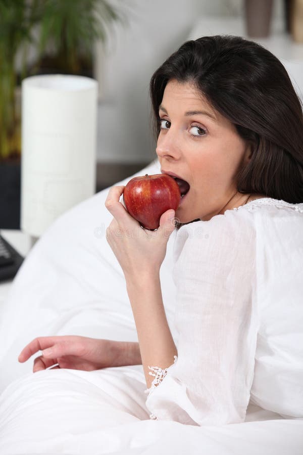 Dark-haired Bourgeoise Crunching Apple Stock Image - Image of ...