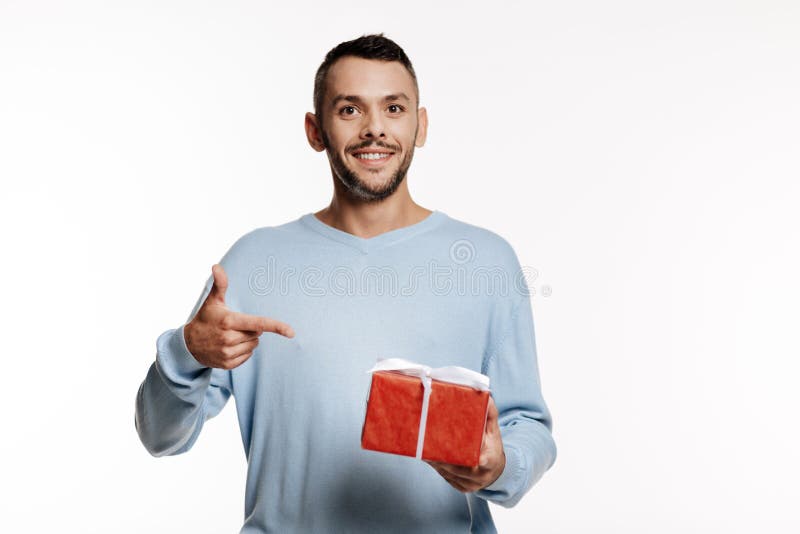 Dark-haired Bristled Man Pointing at Gift Box Stock Photo - Image of ...