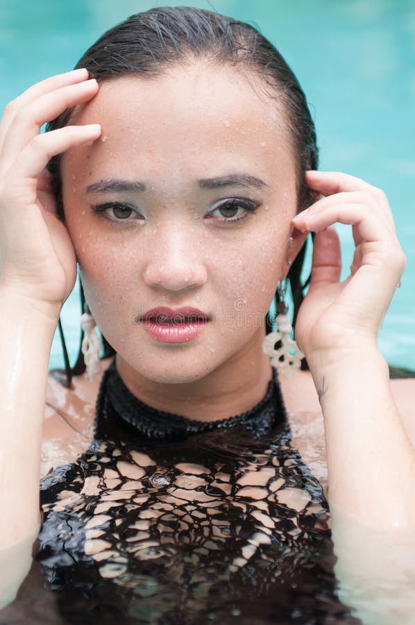 Dark Haired Model with Black Swimsuit at a Pool Stock Photo - Image of ...