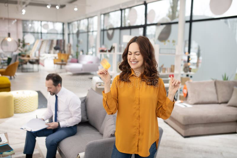 Dark-haired Pretty Customer Feeling Happy after Making a Good Deal ...