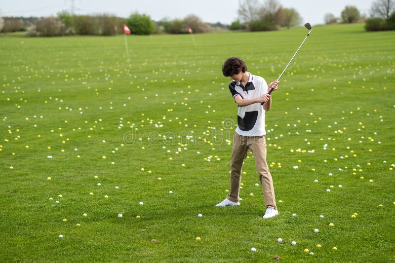 Dark-haired Young Guy Training in a Golf Club Stock Image - Image of ...