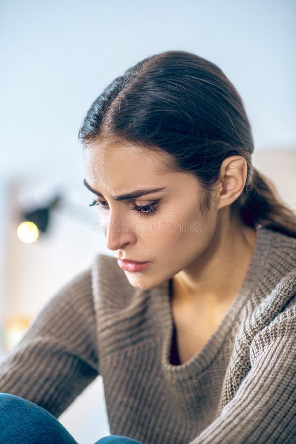 Dark-haired Young Woman Looking Stressed and Unhappy Stock Photo ...