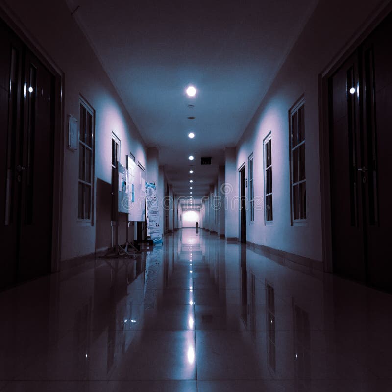 In the Dark Hall There is a View from the Back of a Crowd of Hundreds ...