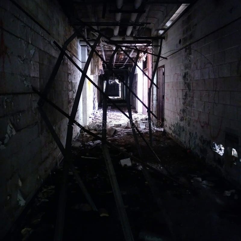 Dark, Decaying Hallway and Graffiti Covered Walls of an Abandoned ...