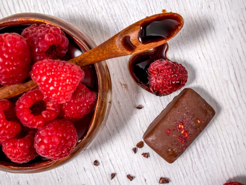 Dark Handmade Chocolate with Raspberries and Syrup Stock Image - Image ...