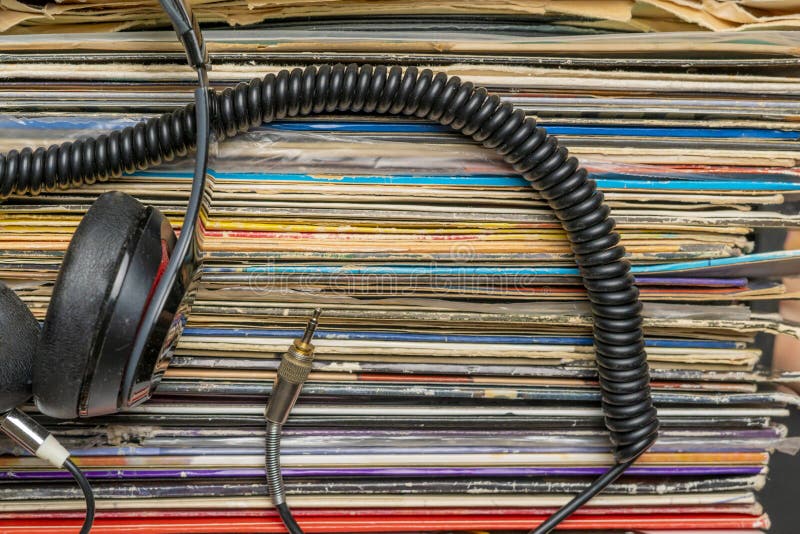 Dark Headphones Lay on Stack of Retro Vinyl Records B Stock Image ...