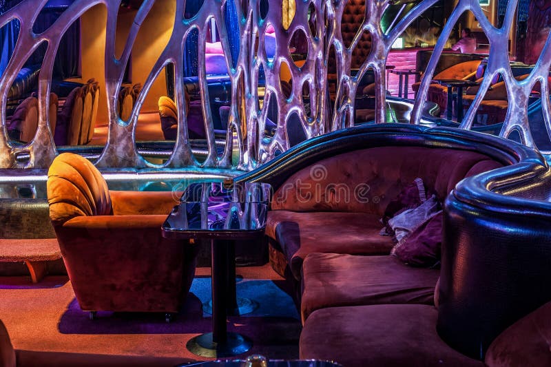 Dark, Illuminated Interior of a Strip Bar with a Stage and Sofas Stock ...