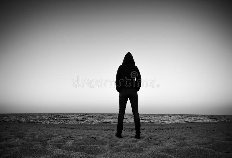 Person Standing on the Beach Looking Out Over the Water Stock Photo ...