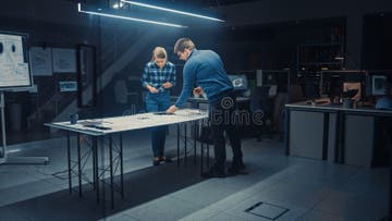 In the Dark Industrial Design Engineering Facility Male and Female ...
