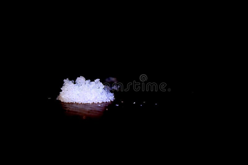 A Lit Salt Pile Trails Off into the Distance on a Table Stock Photo ...