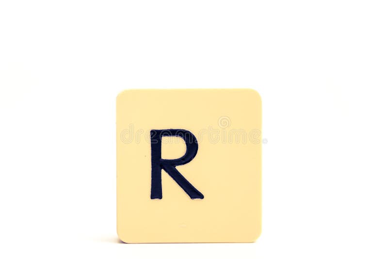 Dark Letter R on a Pale Yellow Square Block Isolated on White ...