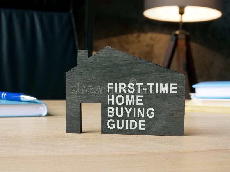 Dark Model of Home with Sign First-time Home Buying Guide. Stock Photo ...