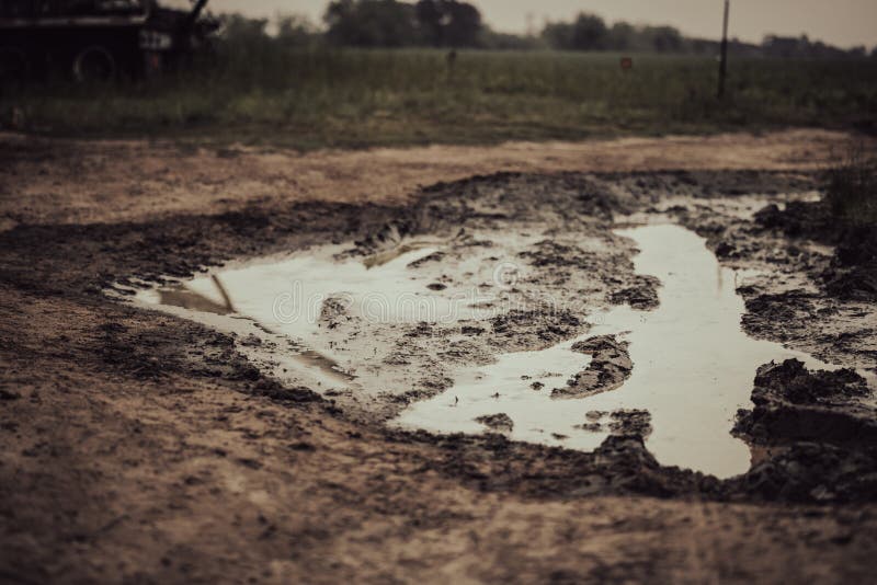A Dark and Moody Mud Puddle Stock Image - Image of dirt, travel: 221245561