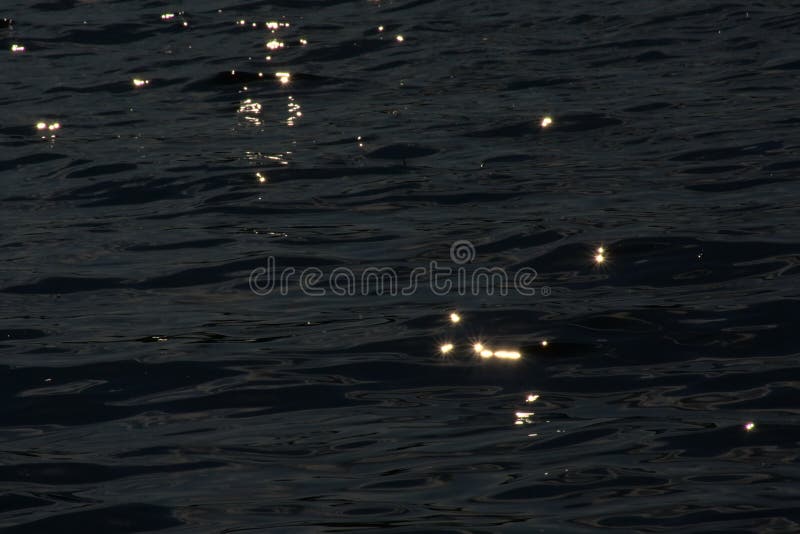 Dark Moving Water Surface with Sparking Sun Reflections Stock Photo ...