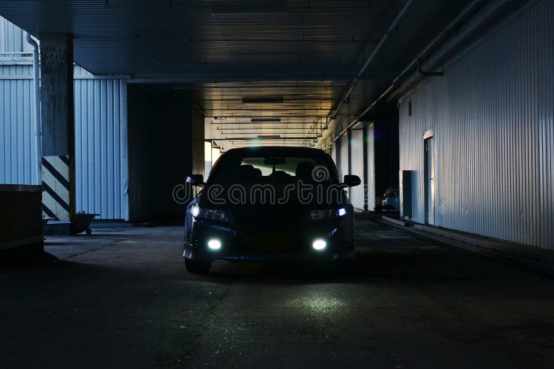 Dark, Mysterious Car Parked in a Dimly Lit Garage Stock Photo - Image ...