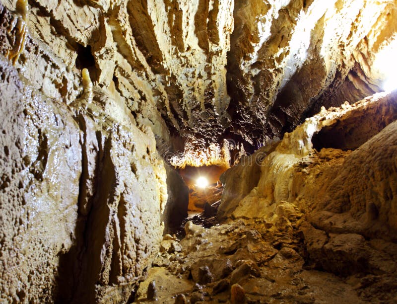 Narrow Cave Passage with a Cave Explorer Stock Image - Image of cave ...