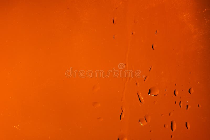 Dark Orange Background with a Drop of Liquid Stock Image - Image of ...