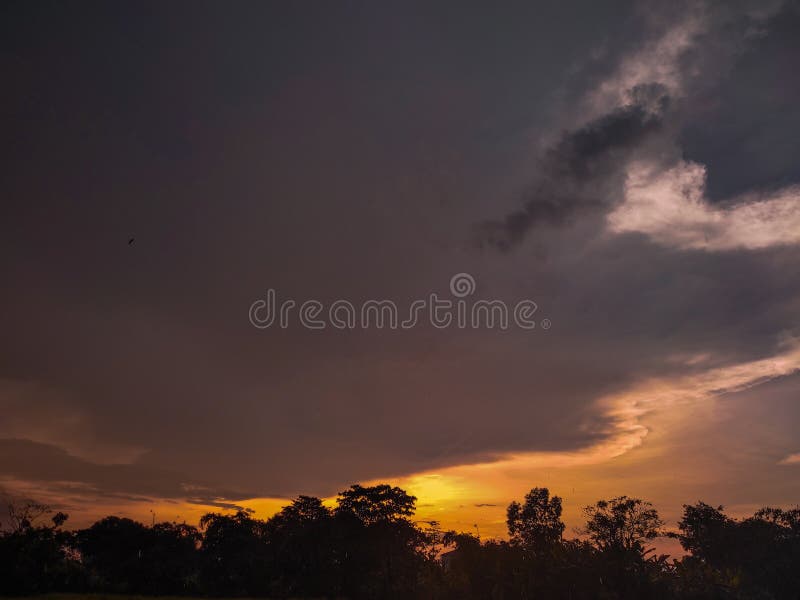 Clouds and Sunset Light Mixed in the Dark Windy Sky Stock Photo - Image ...