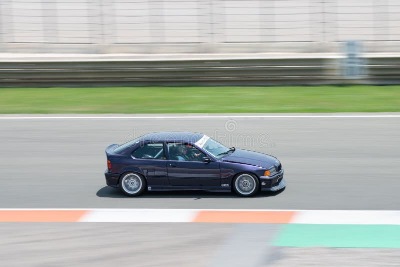 Dark Purple BMW E36 Racing Car Driving on a Track Editorial Image ...