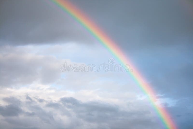 Rainbow Formed after Rain with Clouds and Blue Sky in the Background ...