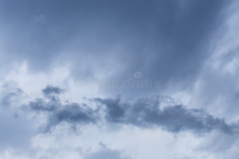 Dark Rainy Clouds with One Even Darker Part in the Middle Stock Image ...
