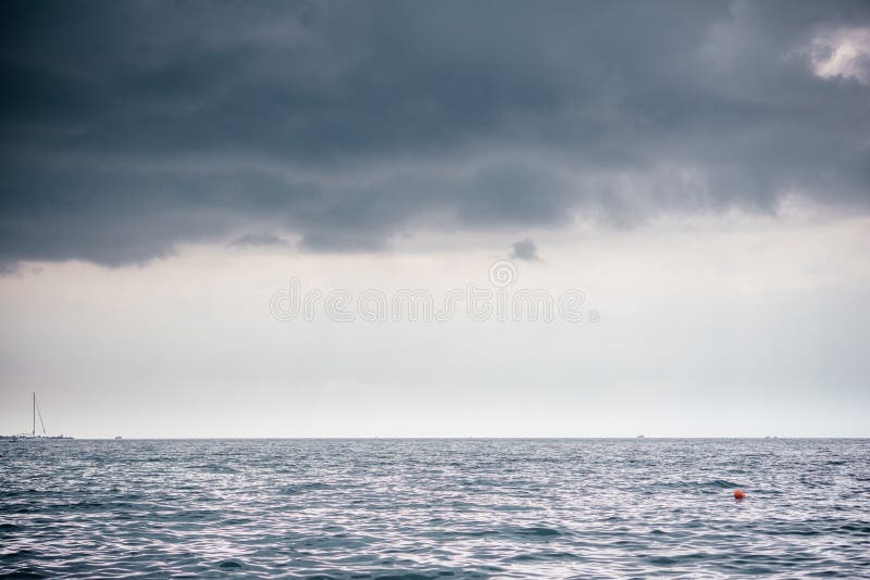 Dark Rainy Clouds Over the Sea Surface Landscape Stock Photo - Image of ...