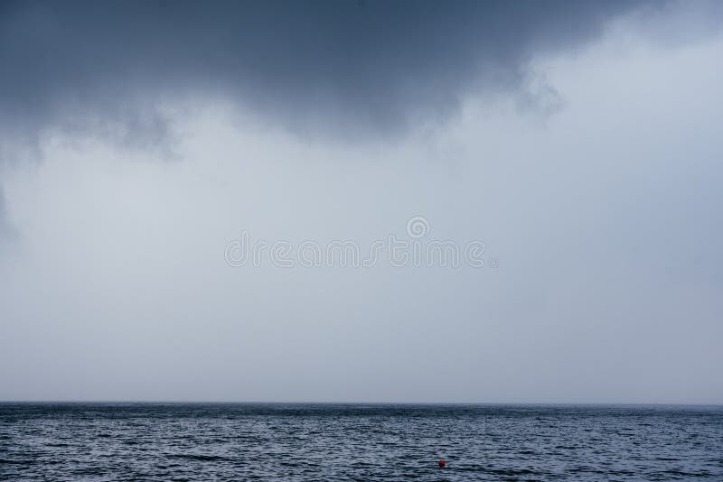 Dark Rainy Clouds Over the Sea Surface Landscape Stock Photo - Image of ...