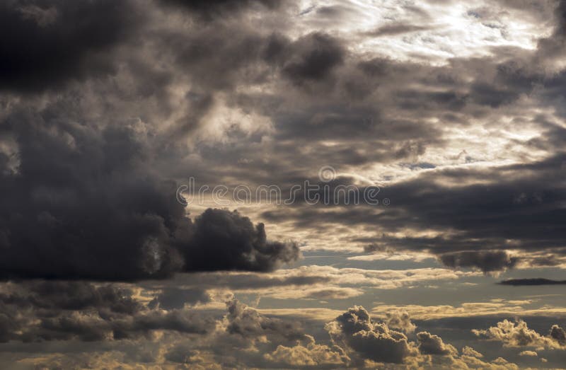 Dark Rainy Clouds during Sunset. Stock Photo - Image of sunset, rays ...