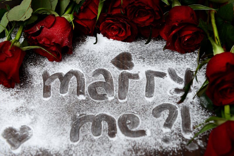 Dark Red Roses and “Marry Me” Sign Stock Image - Image of flower, icing ...