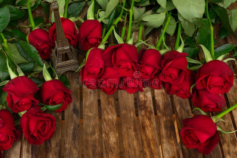 Dark red roses on table stock image. Image of arrangement - 108246265