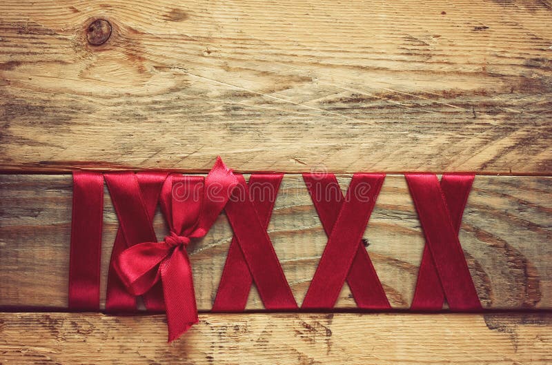 Dark red silk ribbon laced stock image. Image of decoration - 69260293