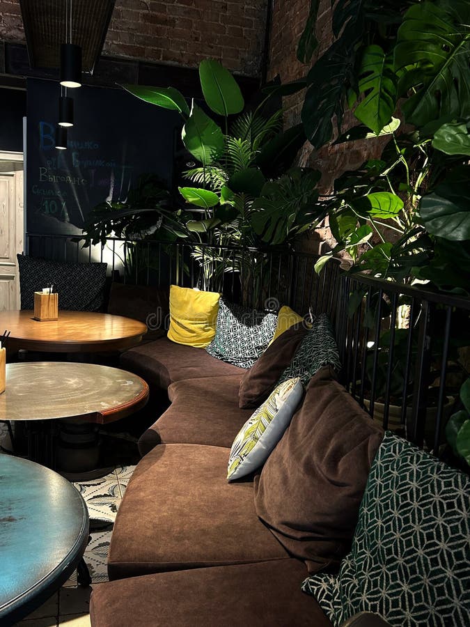 Dark Restaurant Interior with Lights and Plants Stock Photo - Image of ...