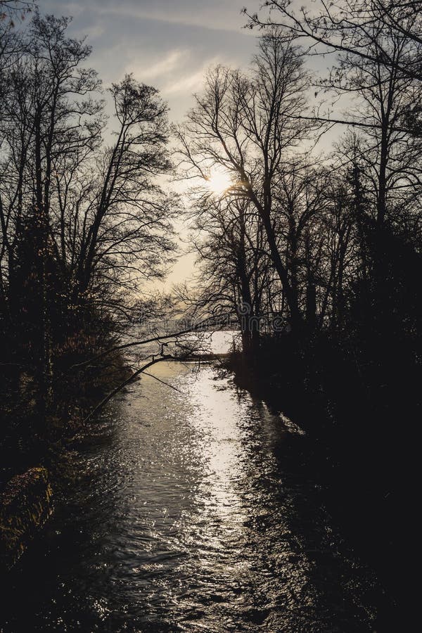 Dark River with Rapids and Rocks Stock Photo - Image of bridge ...