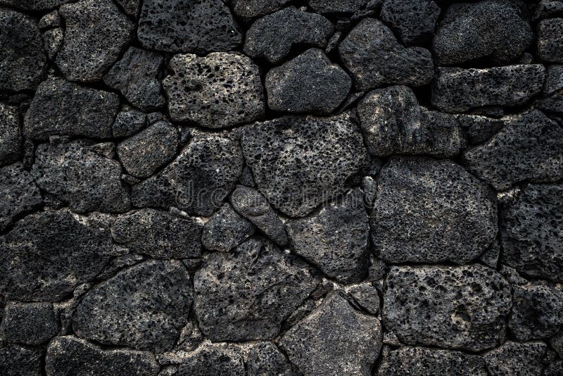 Black volcanic stone wall stock image. Image of natural - 158065727