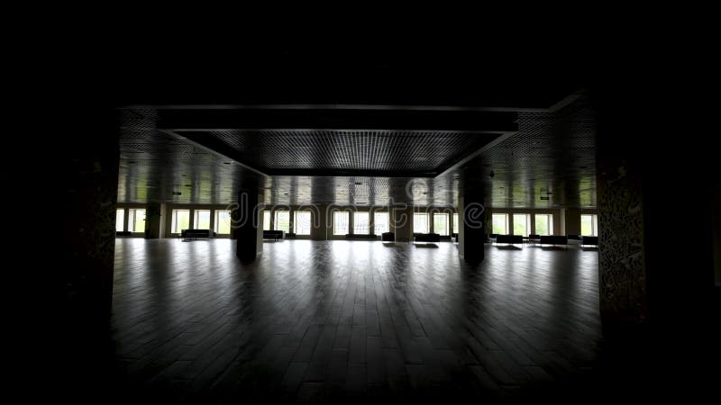 A Dark Room with Columns and Windows at the End. Hall with Columns in ...