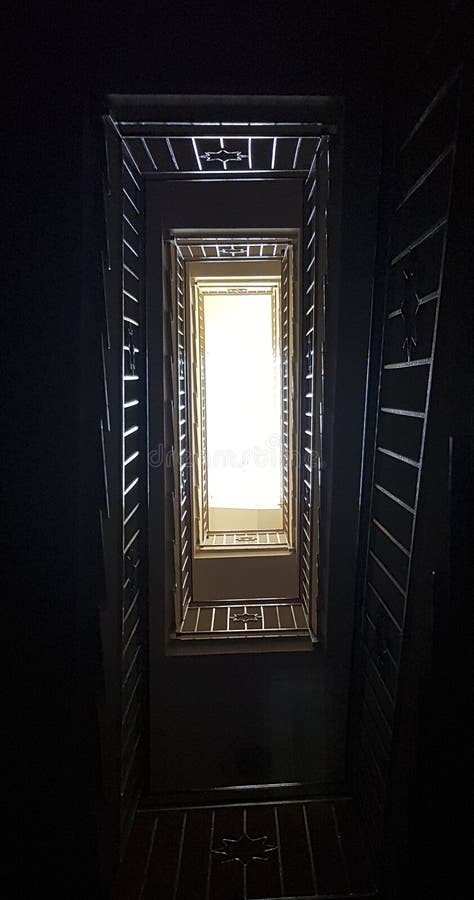 In a Dark Room, Light Shines through a Window, Creating a Contrast ...