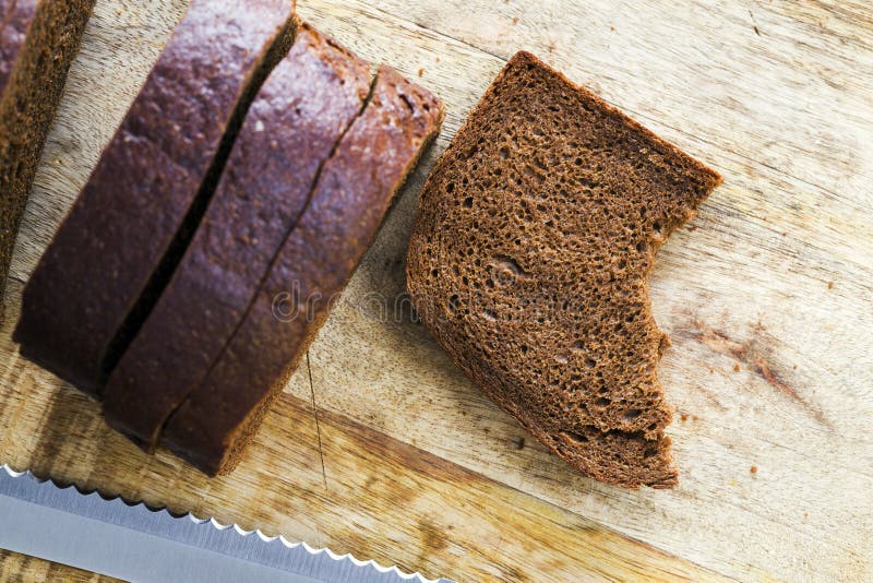 Dark rye bread sliced stock image. Image of bakery, meal - 223366047