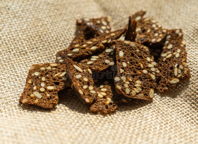 Dark Rye Crackers with Seeds on Sacking. Rustic Style Stock Image ...