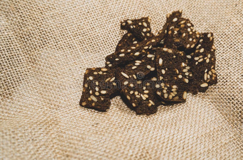 Dark Rye Crackers with Seeds on Sacking. Rustic Style. Healthy Diet ...