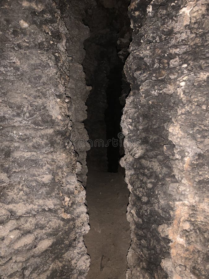 Dark and scary cave stock photo. Image of underground - 231055652