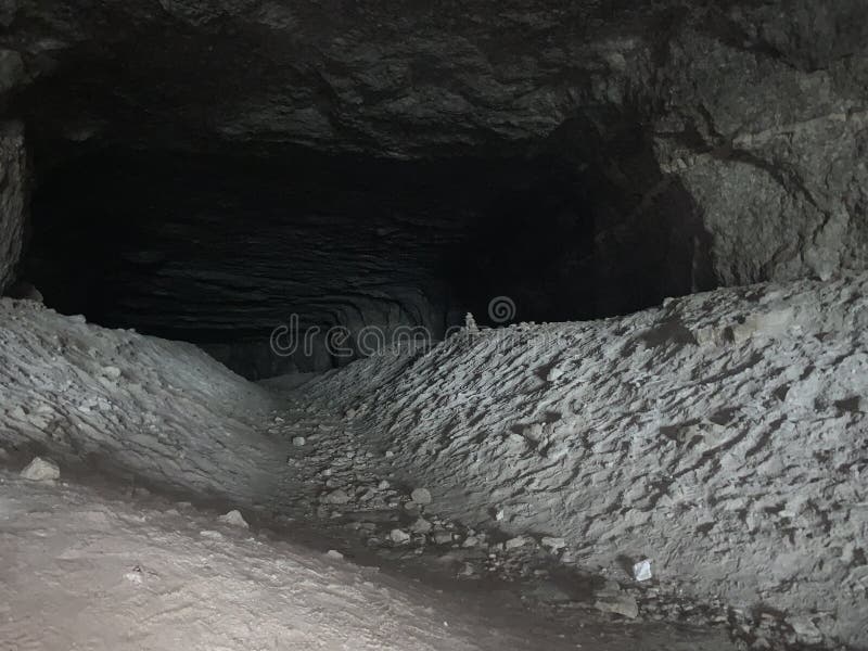 Dark and scary cave stock image. Image of inside, exploration - 231057427