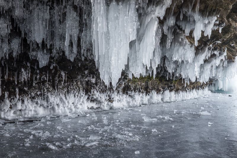 Dark and Scary Icicles in the a Cave and Broken Ice Pieces. Stock Image ...