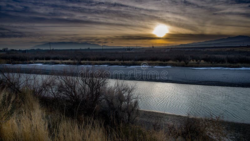 Scary Sunset, with Red Sky and Clouds, after Storm. Power Pylons and ...