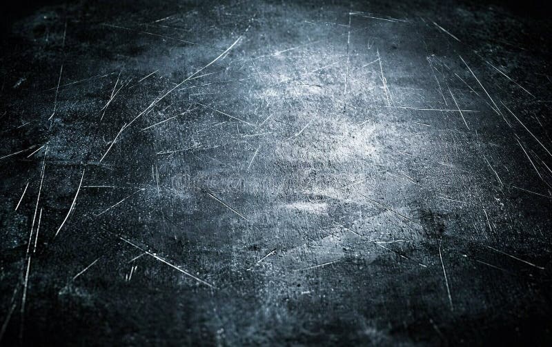 Dark Scratchy Surface with Light Reflections Displaying Texture and Depth in a Dramatic, Moody ...