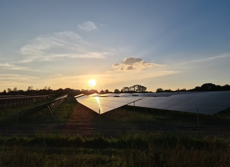 Dark Silhouette of a Solar Park for Power Generation with the Light of ...