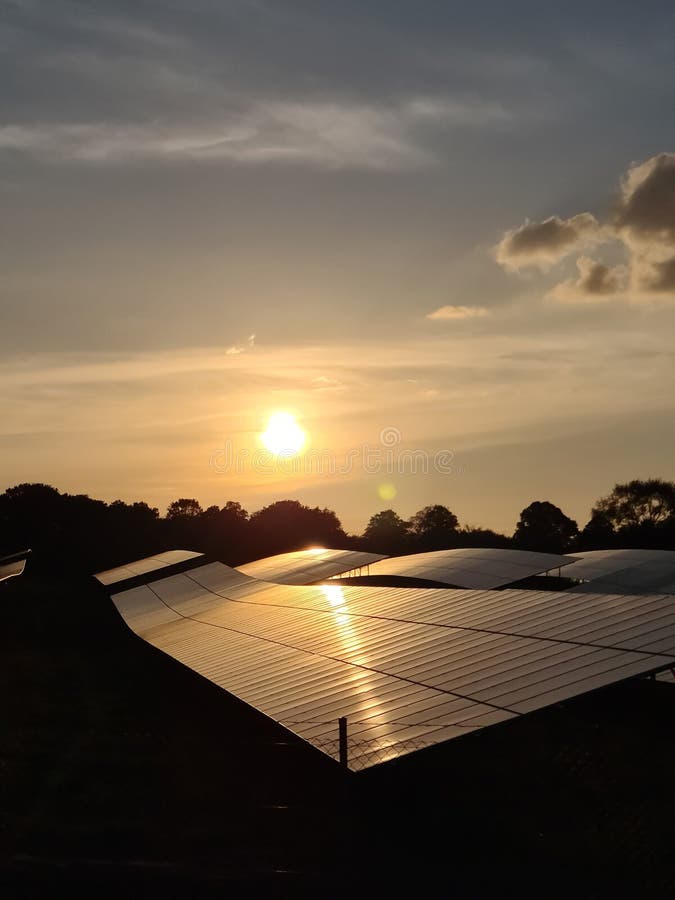 Dark Silhouette of a Solar Park for Power Generation with the Light of ...