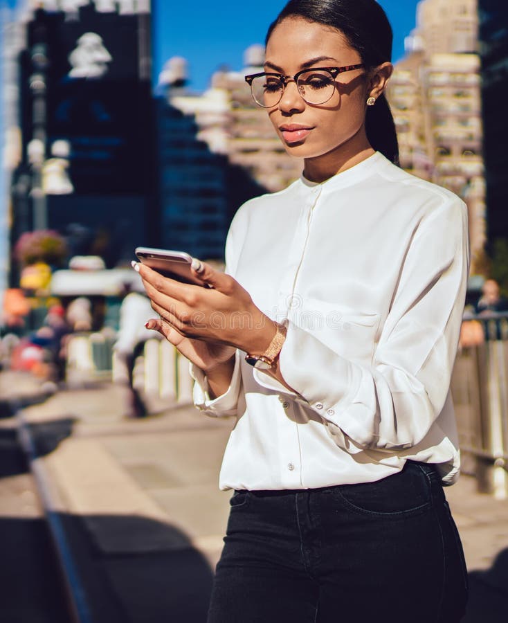 Dark Skinned Female Checking Notification on Smartphone Device Stock ...