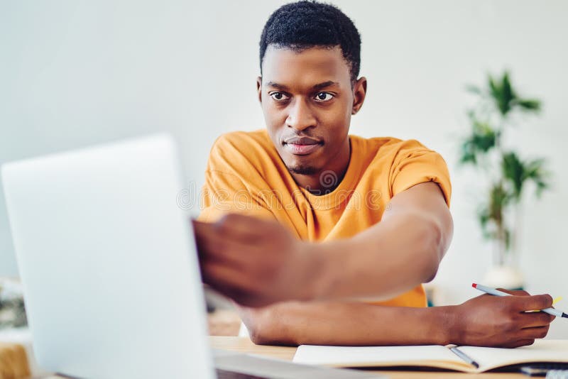 Dark Skinned Students Watching Tutorial while Making Coursework Project ...