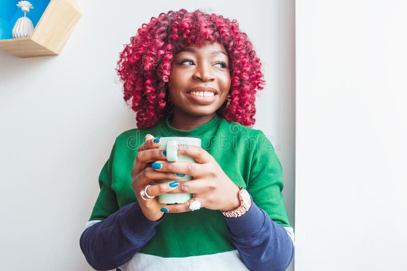 Young Hipster Dark Skinned Woman Dressed In Casual Clothes Holding Cup